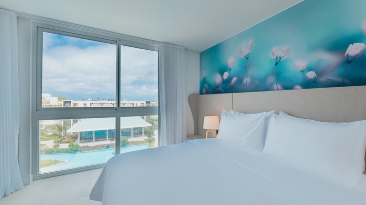 Open-Concept Pool View Suite Featuring A Private Balcony & Two Full ...